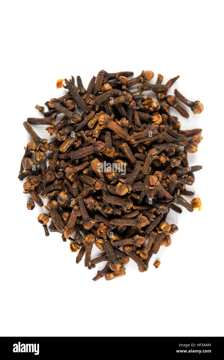 Pile of whole cloves isolated on white background Stock Photo - Alamy