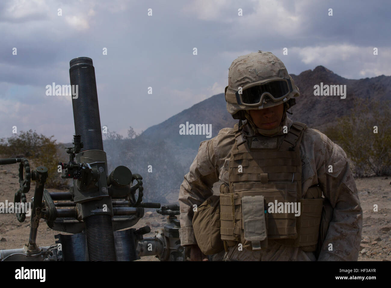 A U.S. Marine Corps field artillery cannoneer with Golf Battery, 2nd ...