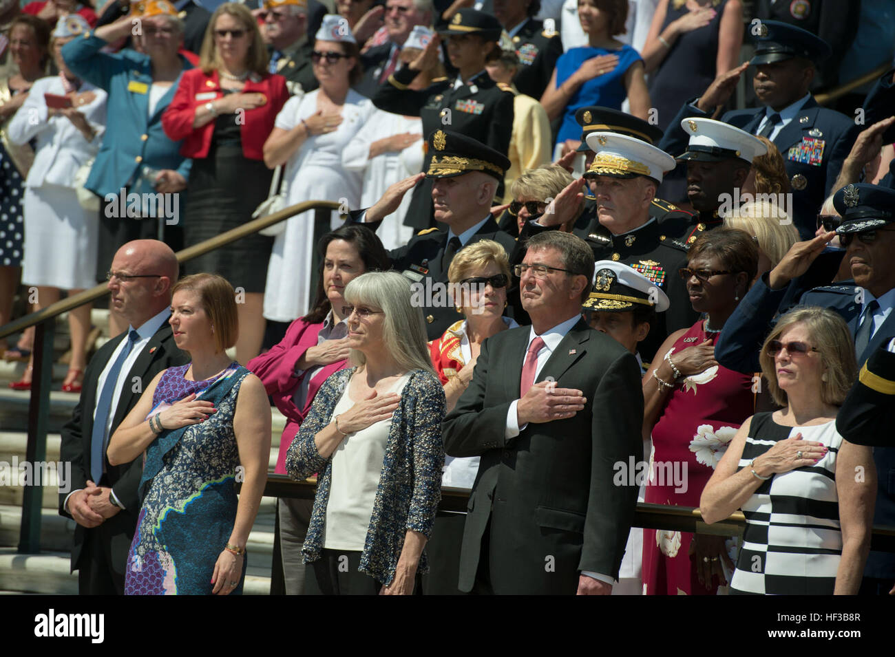 Secretary of Defense Ash Carter places his hand over his heart to pay ...