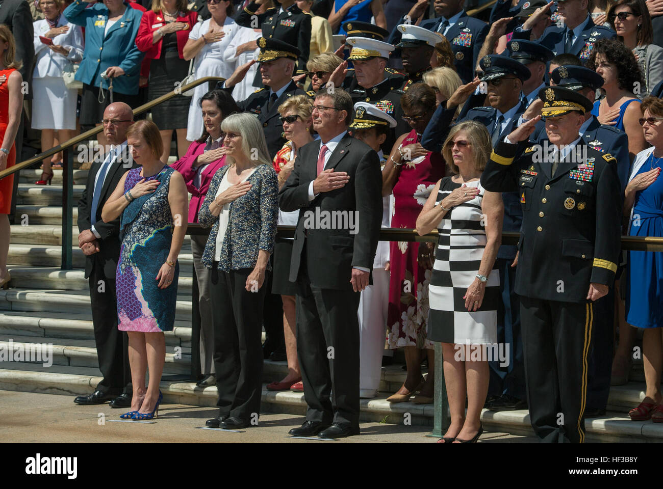 Secretary of Defense Ash Carter places his hand over his heart as a ...