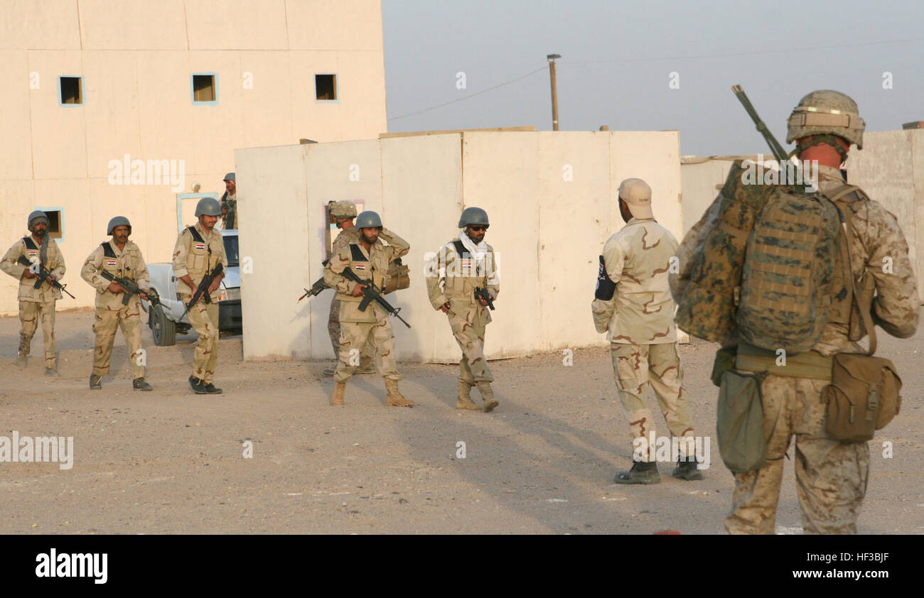 Role-players acting as Iraqi police assist Marines from Kilo Company ...