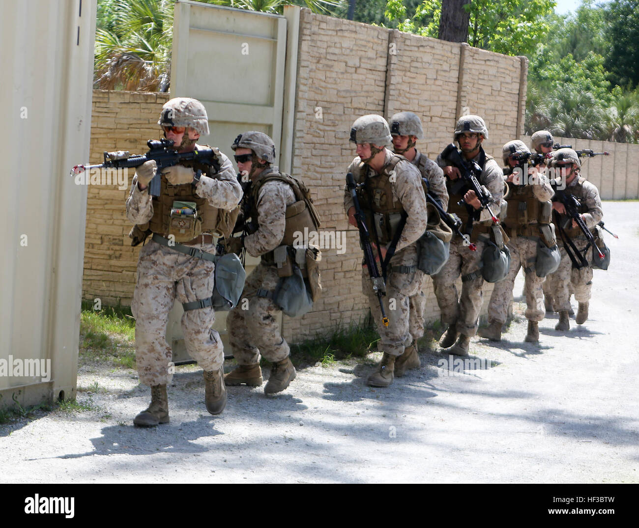 Marines with Company E, Battalion Landing Team 2/6 conduct military operations in urban terrain ...
