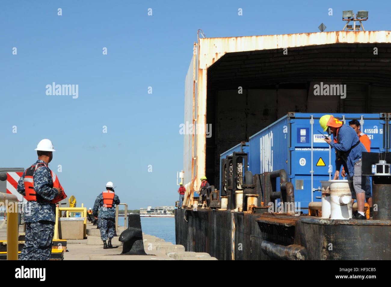 Sailors facilitate the docking of the supply barge at joint Base Pearl ...