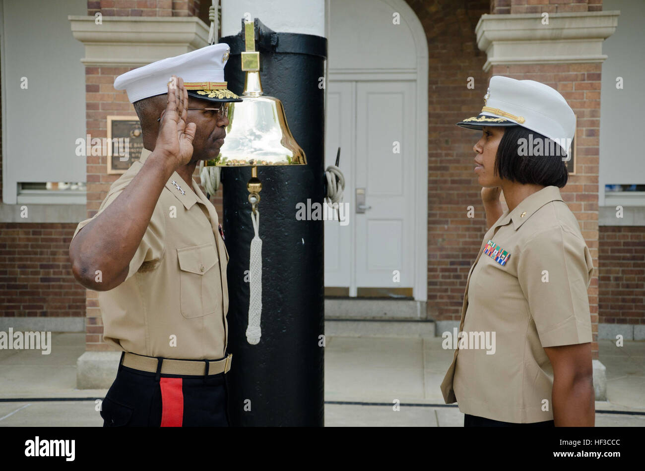 U.S. Marine Corps Maj. Lisa Lawrence, right, recites the Uniformed ...
