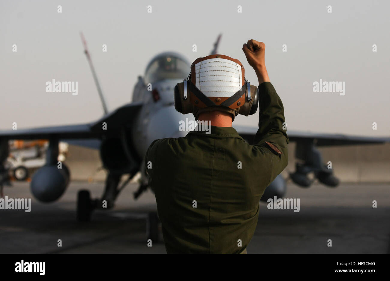 A U.S. Marine plane captain with Marine Fighter Attack Squadron 232 ...