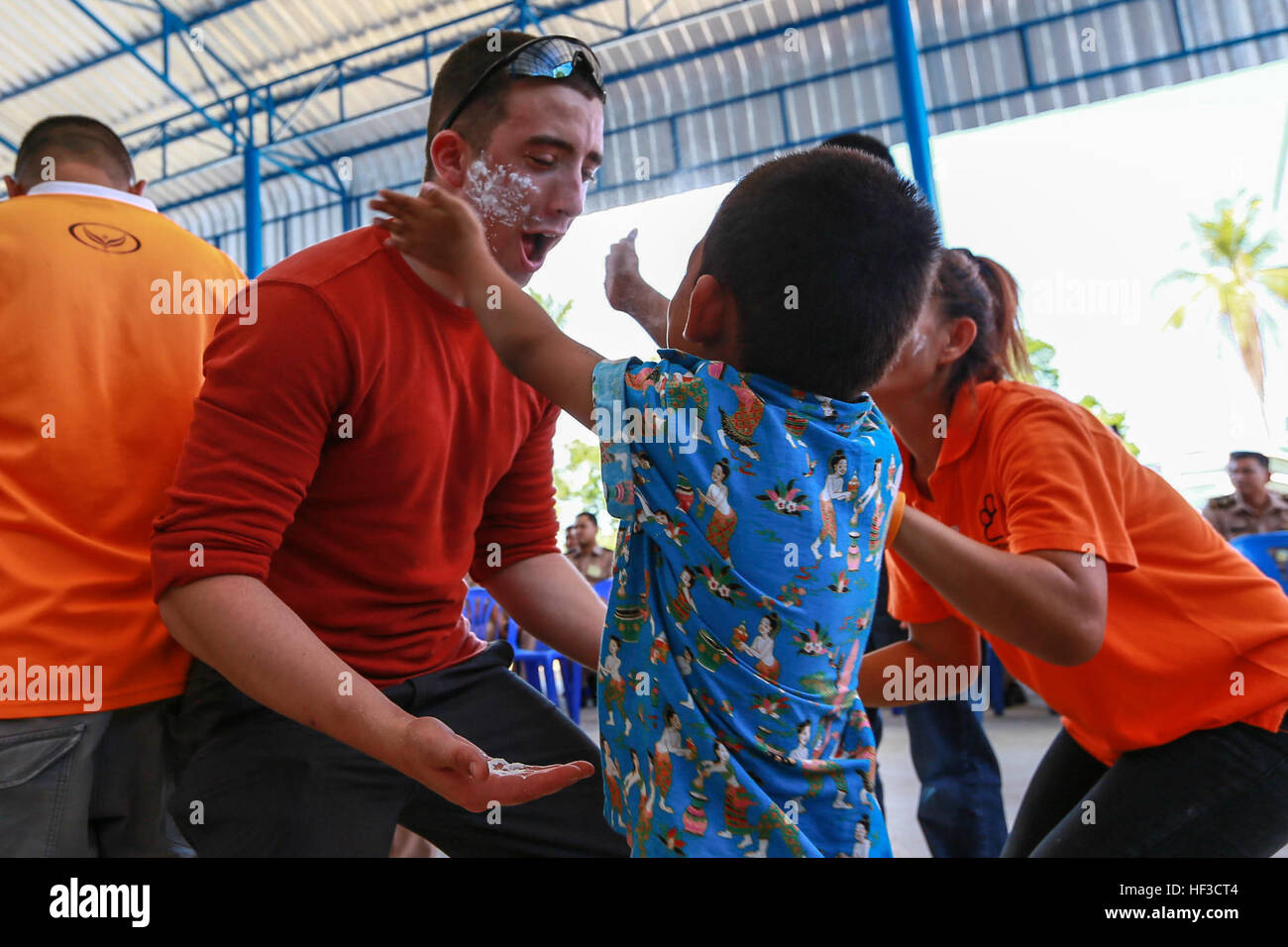 A U.S. Marine with the 15th Marine Expeditionary Unit interacts with a ...