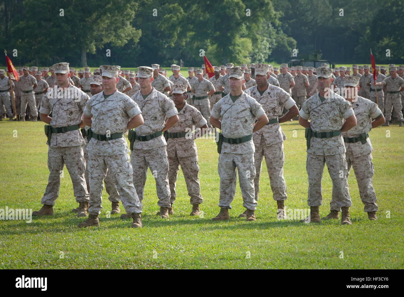 Staff members stand at parade rest during the School of Infantry-East ...