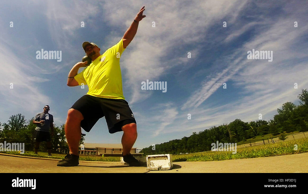 U.S. Marine Corps veteran Matthew Roach prepares to throw a shot put ...