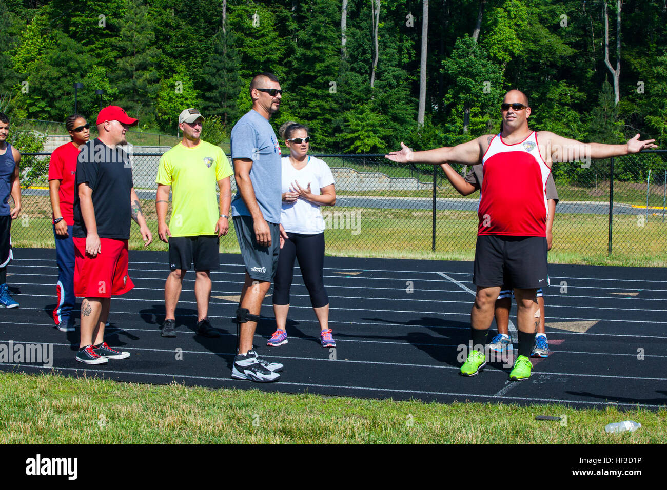 Members of the U.S. Marine Corps All-Marine Team practice field events ...