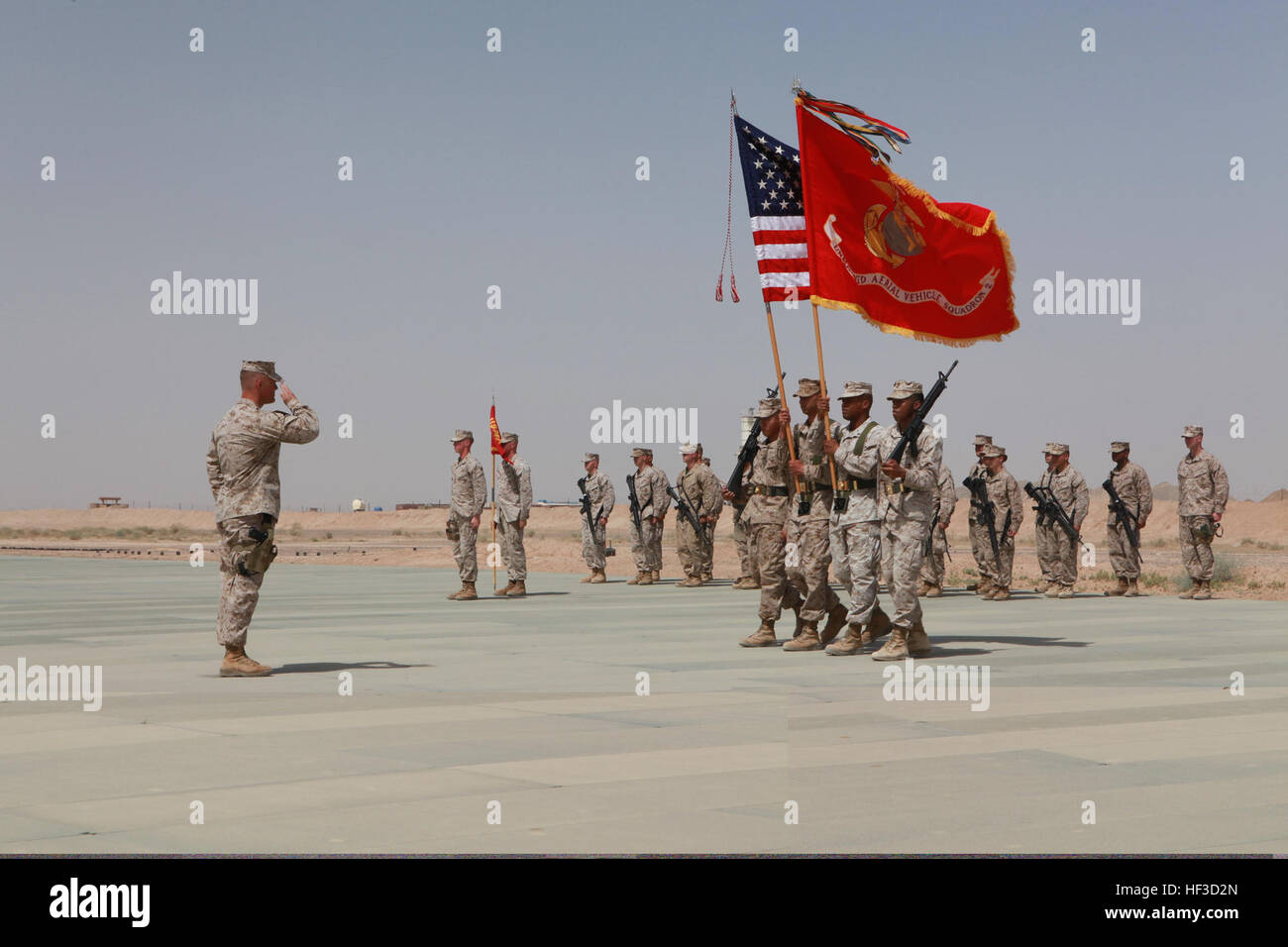 The Marine Unmanned Aerial Vehicle Squadron 2 color guard present the battle colors during the ...