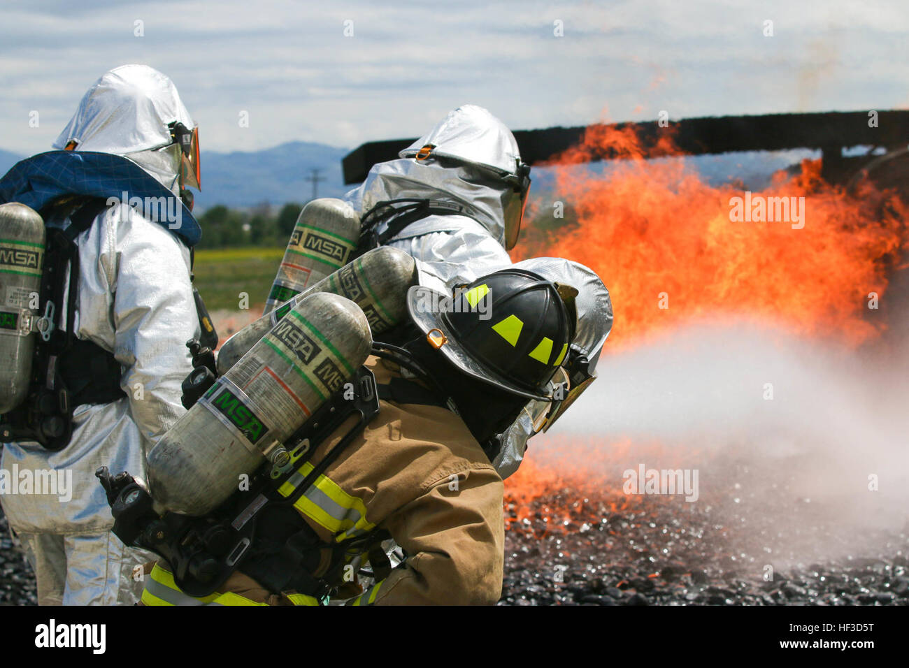 Soldiers with the Montana National Guard Firefighting Group suppress a ...