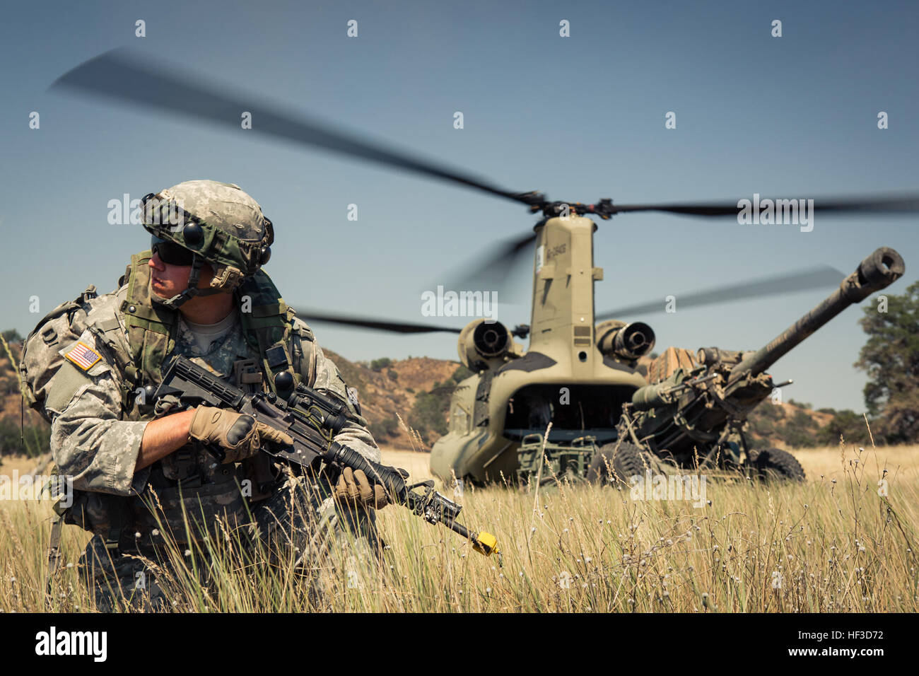Second Lt. Alex Joyce, Bravo Battery, 1-143rd Field Artillery, pulls LZ security during an air ...