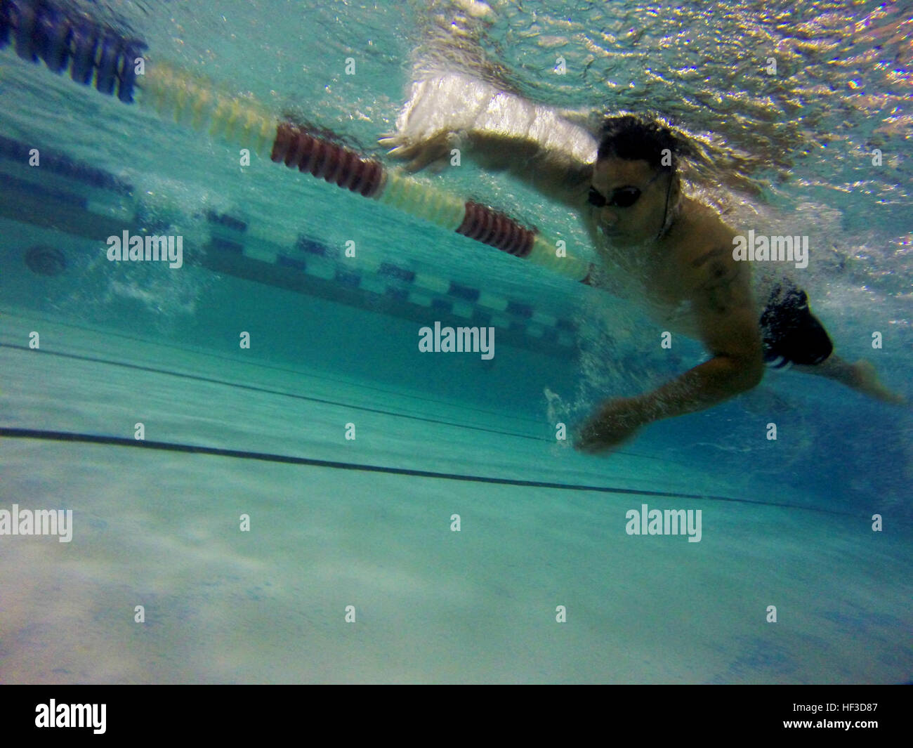 U.S. Marine Corps Cpl. Marcus Chischilly swims laps during a practice ...