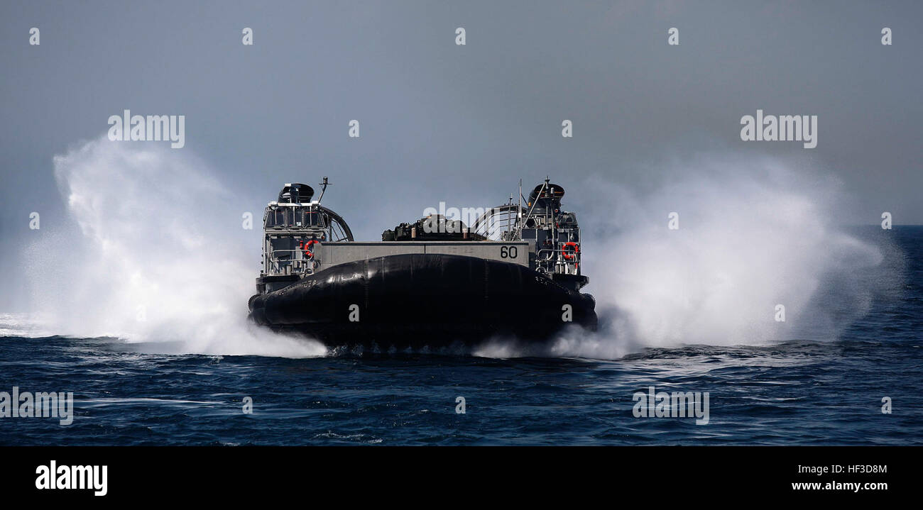 A Landing Craft Air Cushion (LCAC) carries an M1A1 Abrams tank to the ...