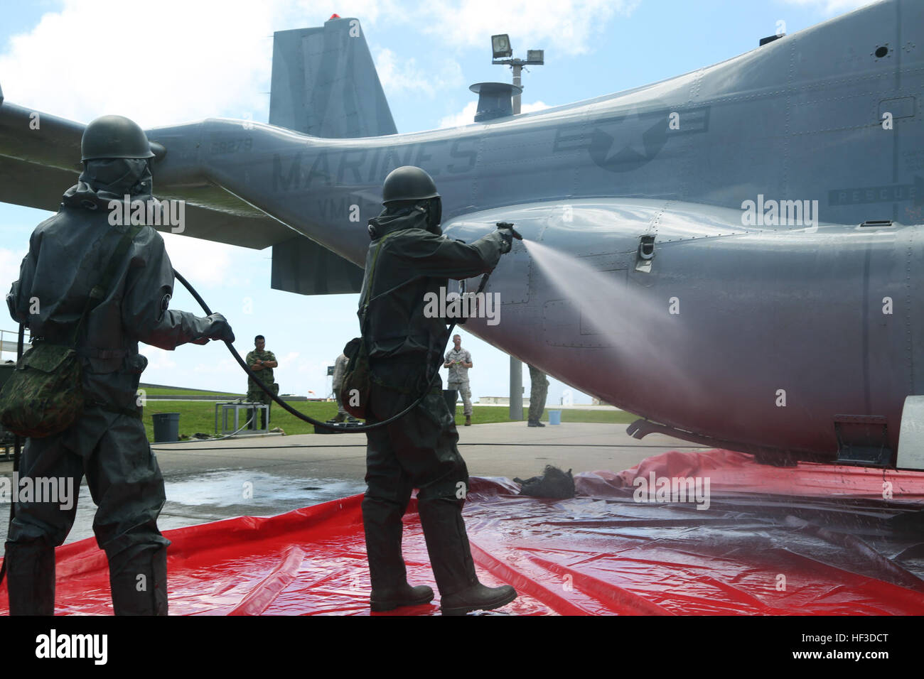 Japan Ground Self-Defense Force members begin decontamination drills on ...
