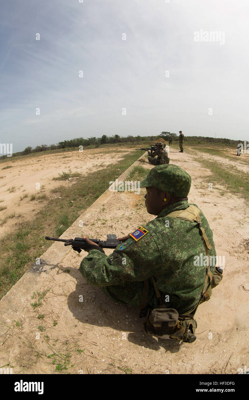 Belize Defense Force 2nd Lt. Herey Morgan, shoots an M4 Service Rifle ...
