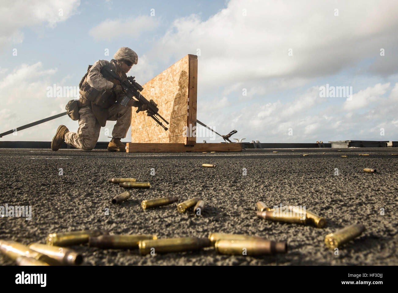 U.S. Marine Lance Cpl. Jose Garcia moves to his next shooting position ...