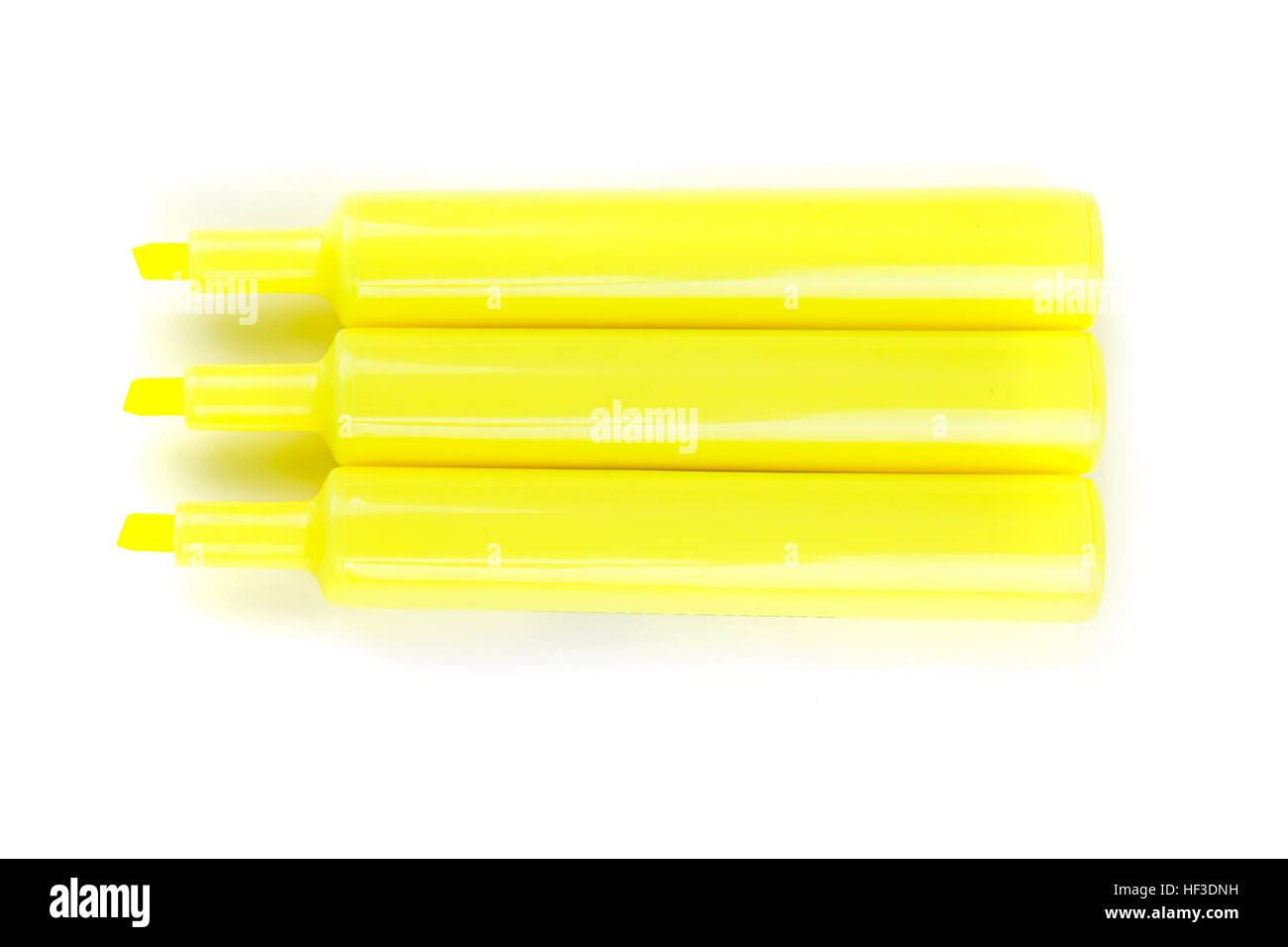 Three yellow highlighters isolated on white background Stock Photo - Alamy