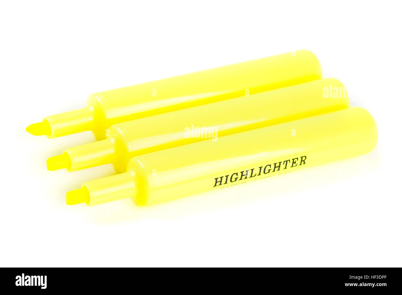 Three yellow highlighters isolated on white background Stock Photo - Alamy