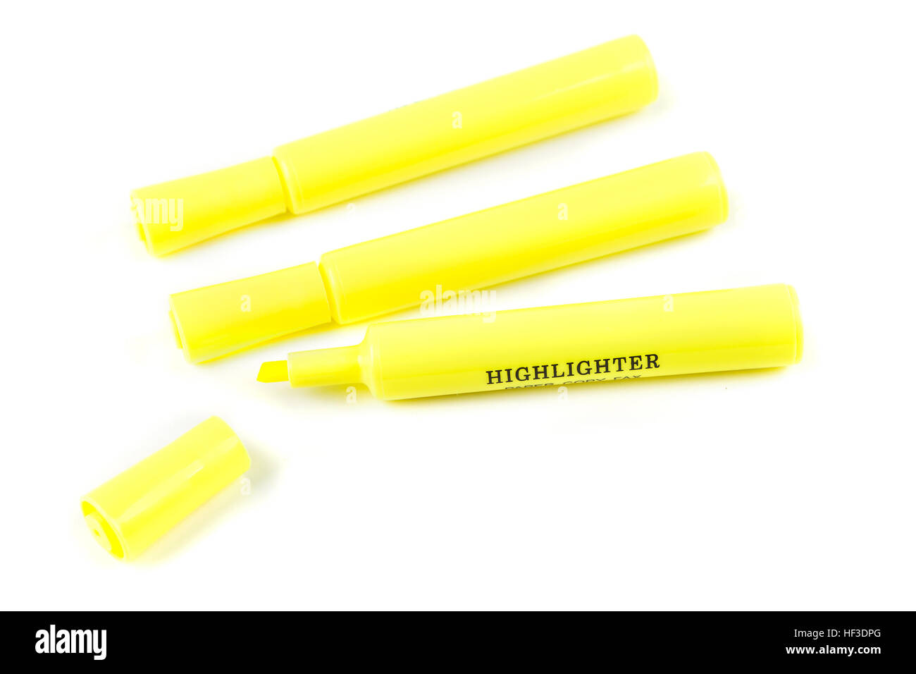 Three yellow highlighters isolated on white background Stock Photo - Alamy