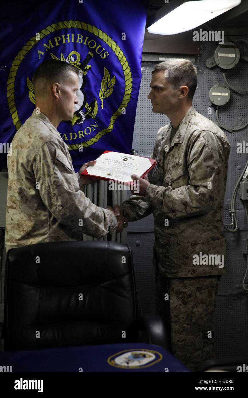 Maj. Gen. Carl Mundy III, left, commander of Task Force 51, awards Capt ...