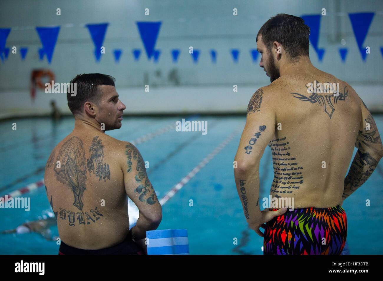 U.S. Marine Corps veteran Sgt. Justin Wess, left, listens to veteran ...