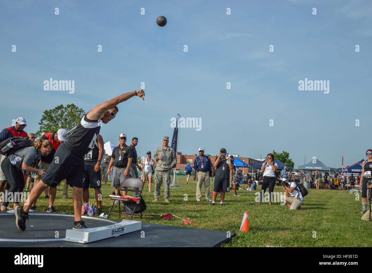 A member on the Team Army practices the Shot Put competition during the ...