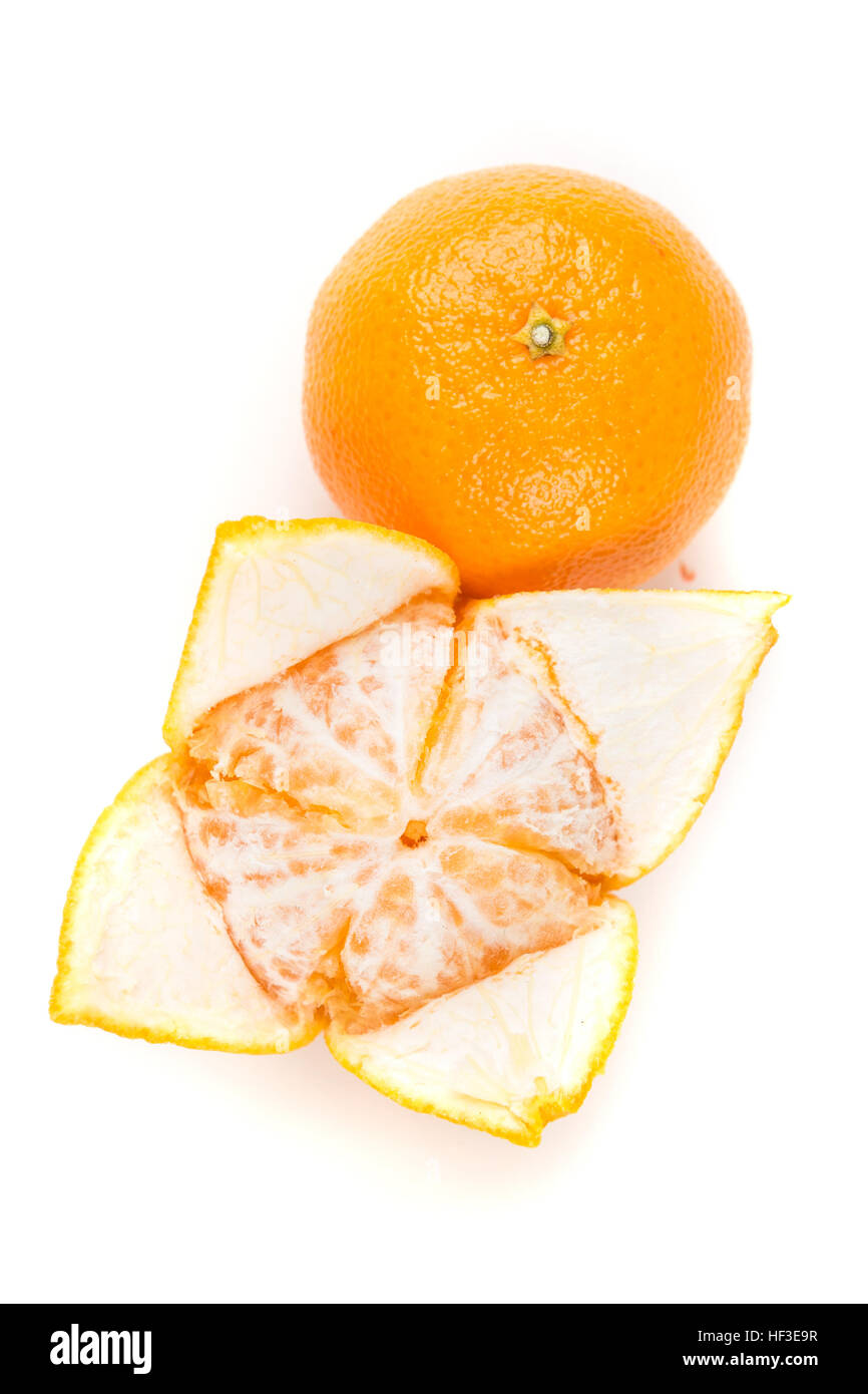 Two navel oranges one peeled one unpeeled isolated on white background ...