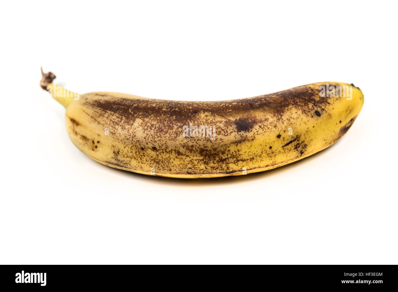 Old beaten banana isolated on white background Stock Photo - Alamy