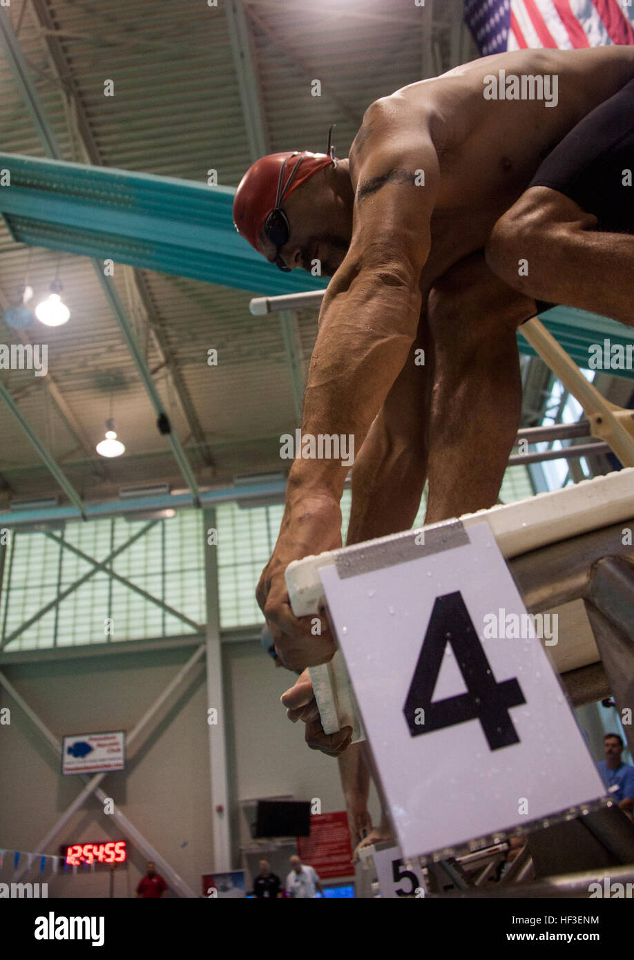 A member of U.S. Marine team competes in the swimming portion of the ...
