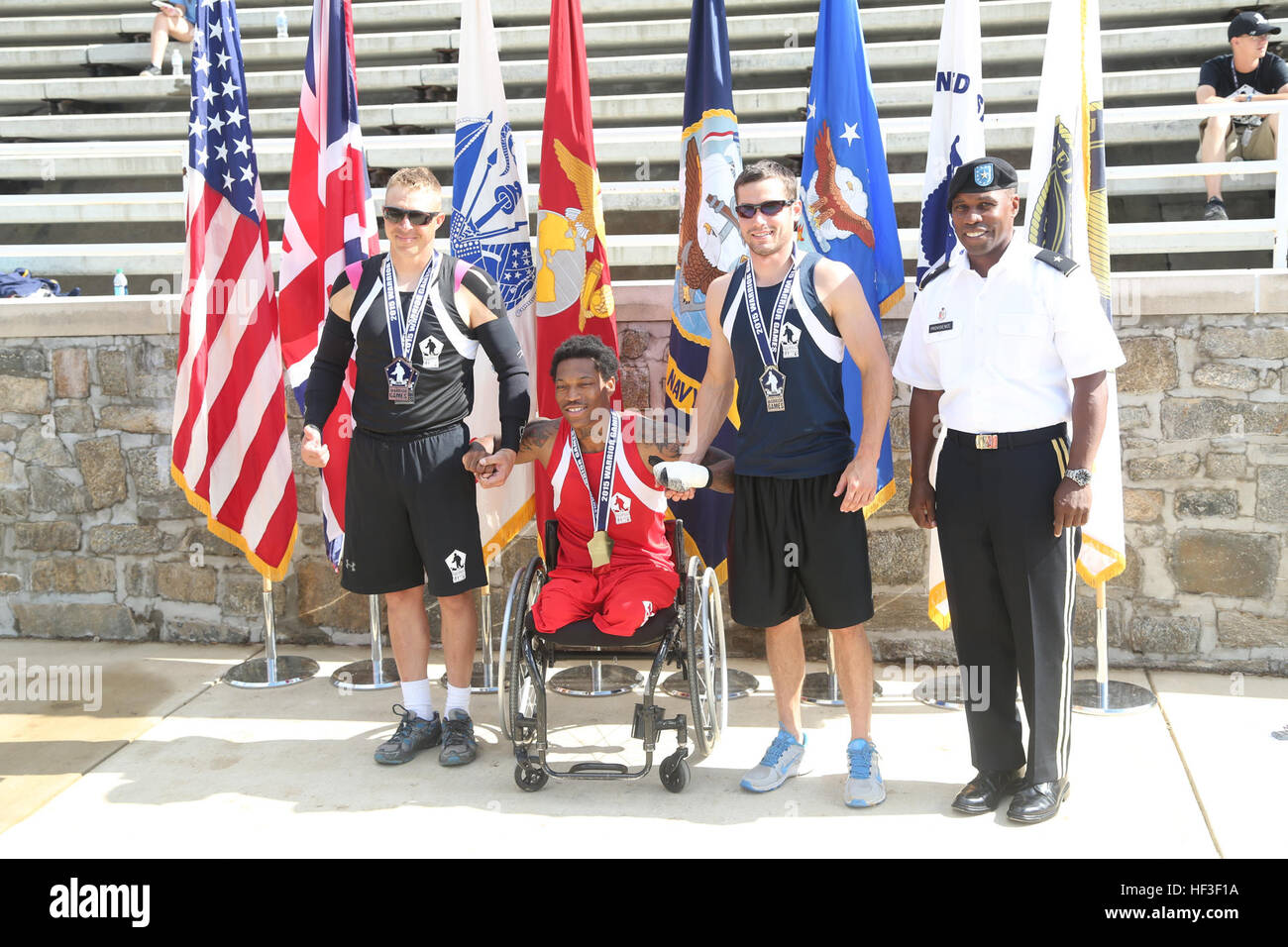 U.S. Marine Corps veteran Anthony McDaniel, center left, receives a ...