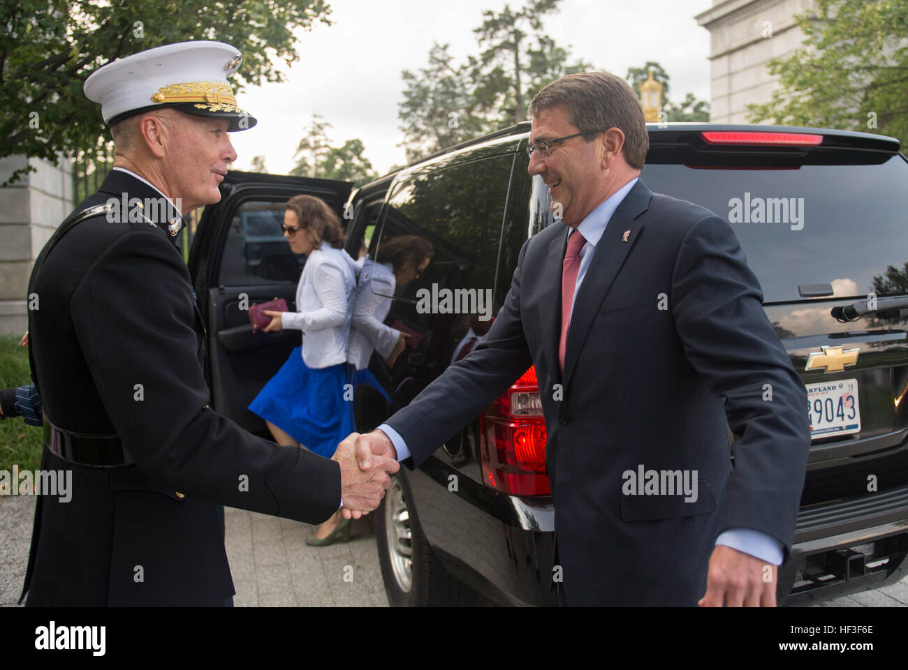 Secretary of Defense Ash Carter is greeted by Marine Corps Commandant ...