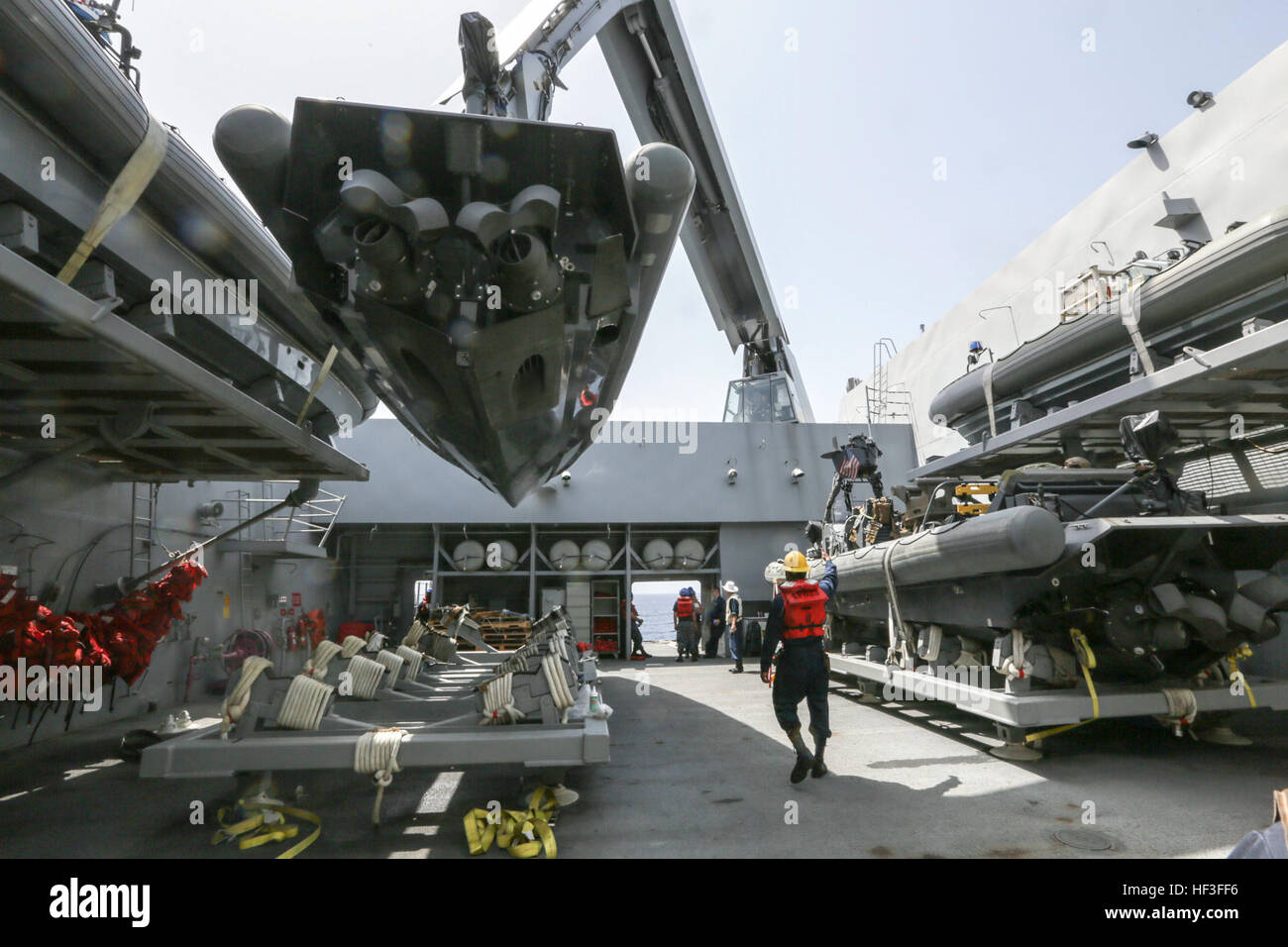 GULF OF ADEN (July 2, 2015) A crane lifts a rigid-hulled inflatable ...