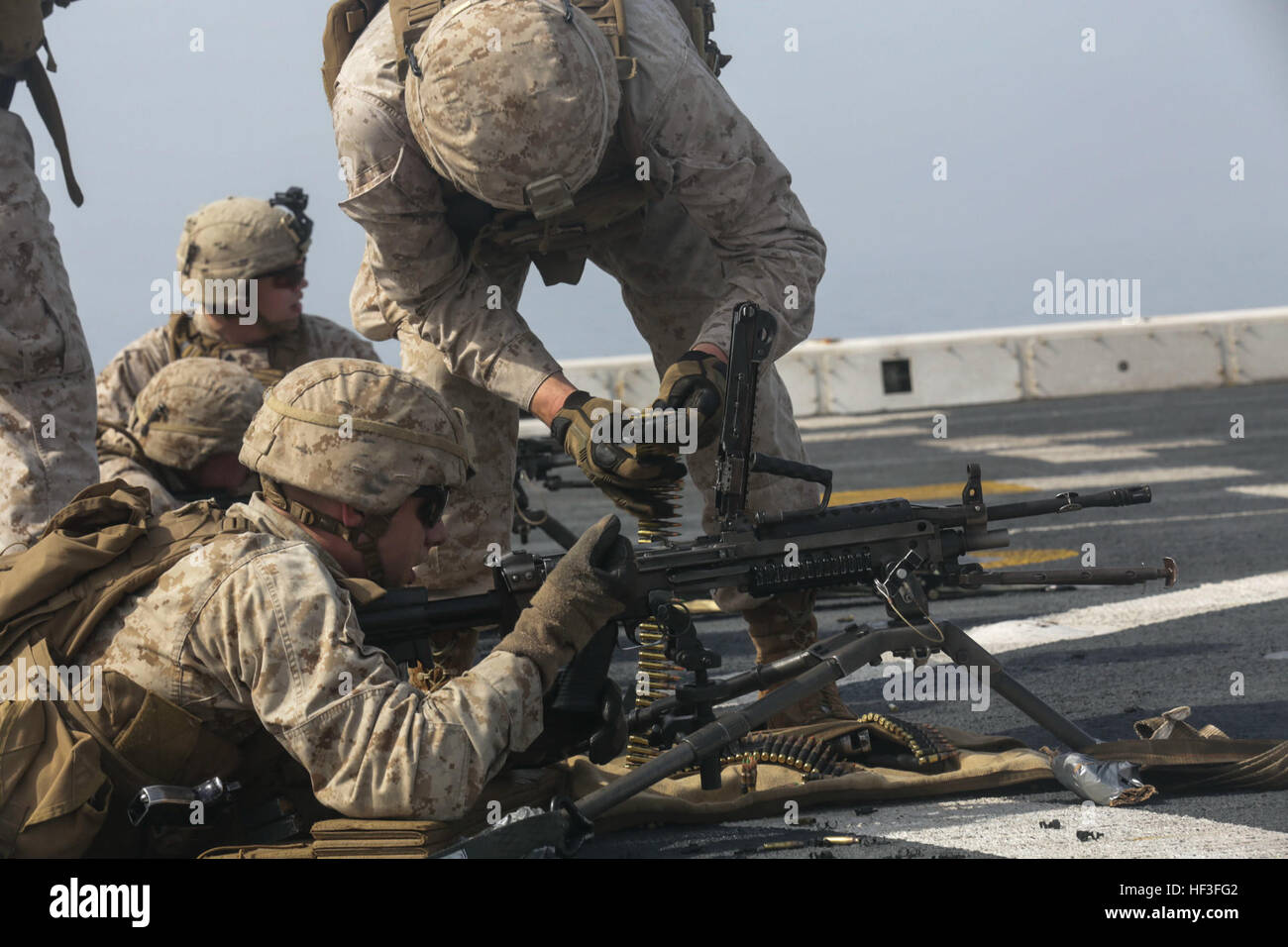 GULF OF ADEN (July 2, 2015) U.S. Marine Lance Cpl. Taylor Baur loads an ...