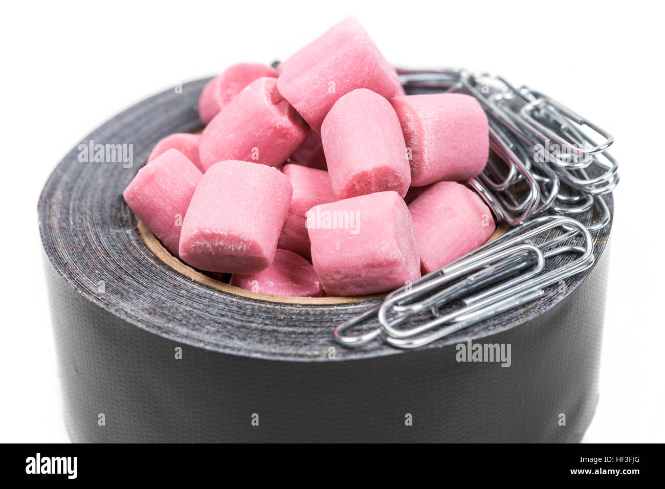 Concept, Held together by tape, bubblegum, and paper clips isolated on ...