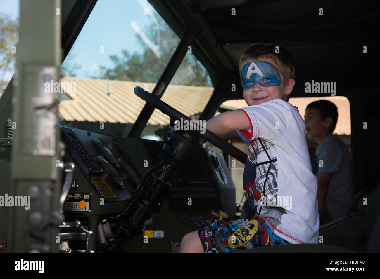 Ryan Frost sits behind the wheel of a U.S. Marine Corps MKR-15 wrecker ...