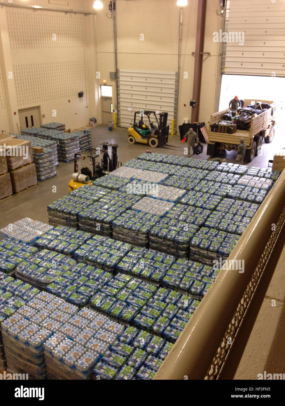 Water bottles fill the drill shed floor of the New York Army National ...
