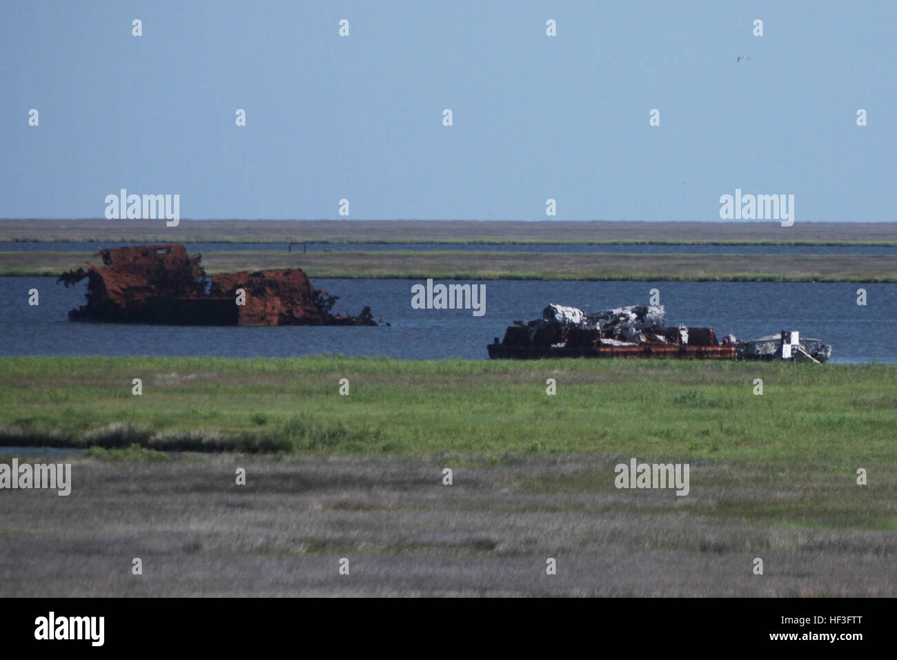 Depleted barges demonstrate the aftermath of live-fire practice during ...