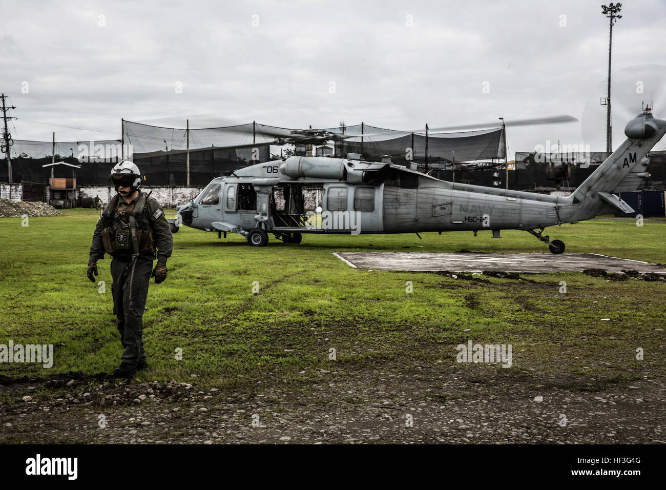 A U.S. Navy Air Crew member walks away from an SH-60 Seahawk during ...