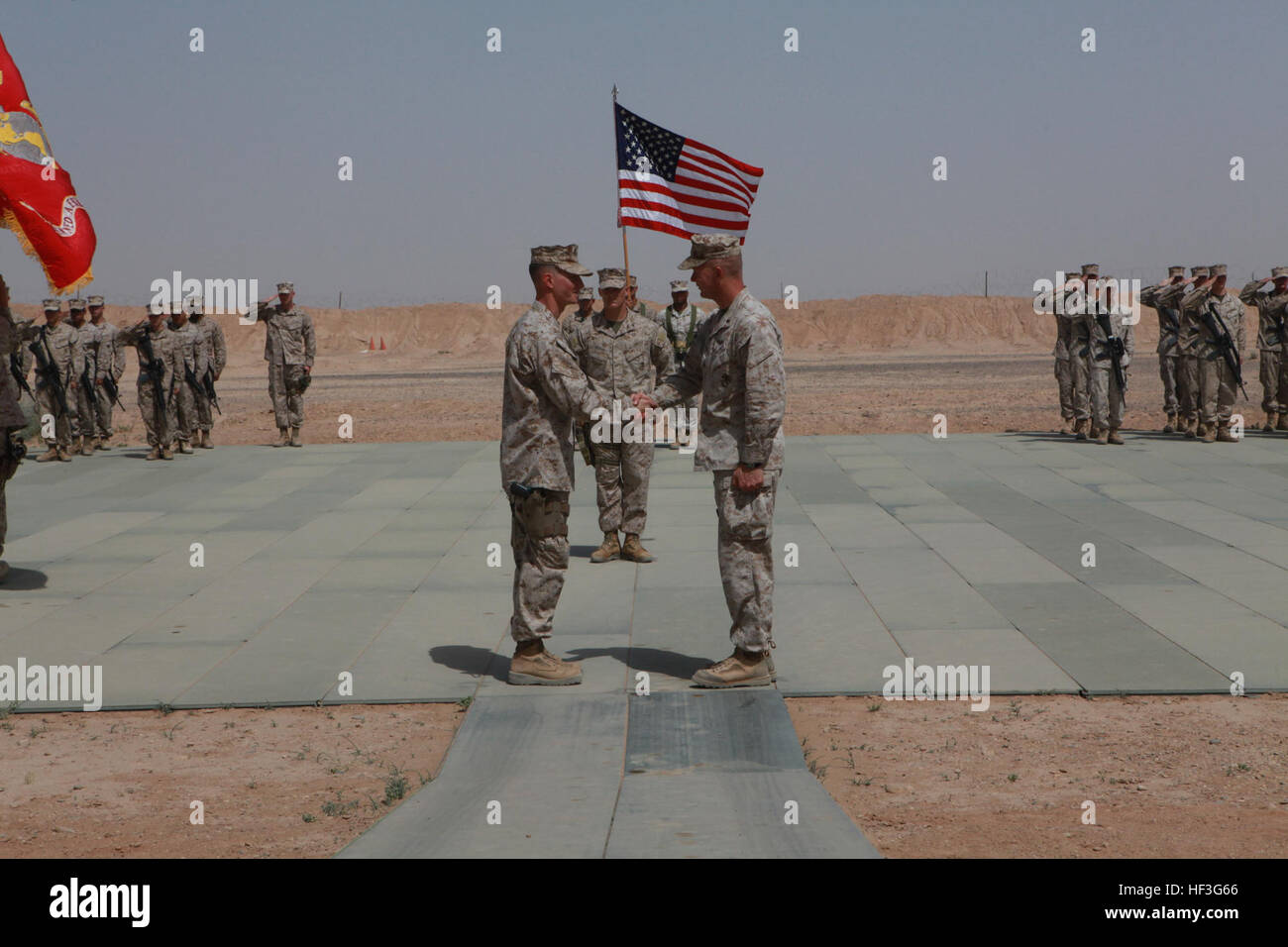 Lt. Col. Daniel T. Lathrop shakes hands with Lt. Col. Mikel R. Huber ...