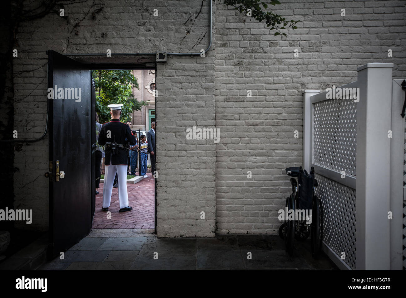 A U.S. Marine assigned to Marine Barracks Washington (MBW) stands guard ...