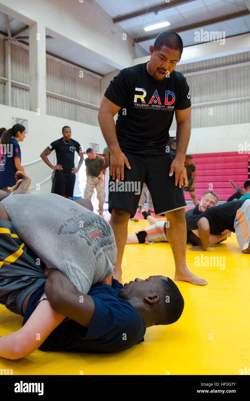 Mixed martial arts fighter Mark Munoz (right) gives pointers to Lance ...