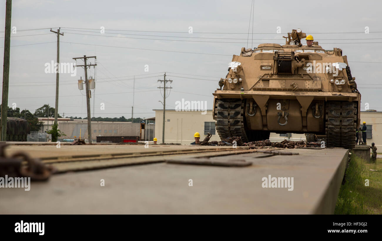 An M88 armored recovery vehicle steadily makes its way down the rail ...