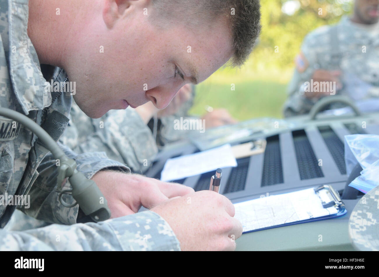 Second Lt. Jack McMahan, of Hattiesburg, Miss., plots points on a map ...