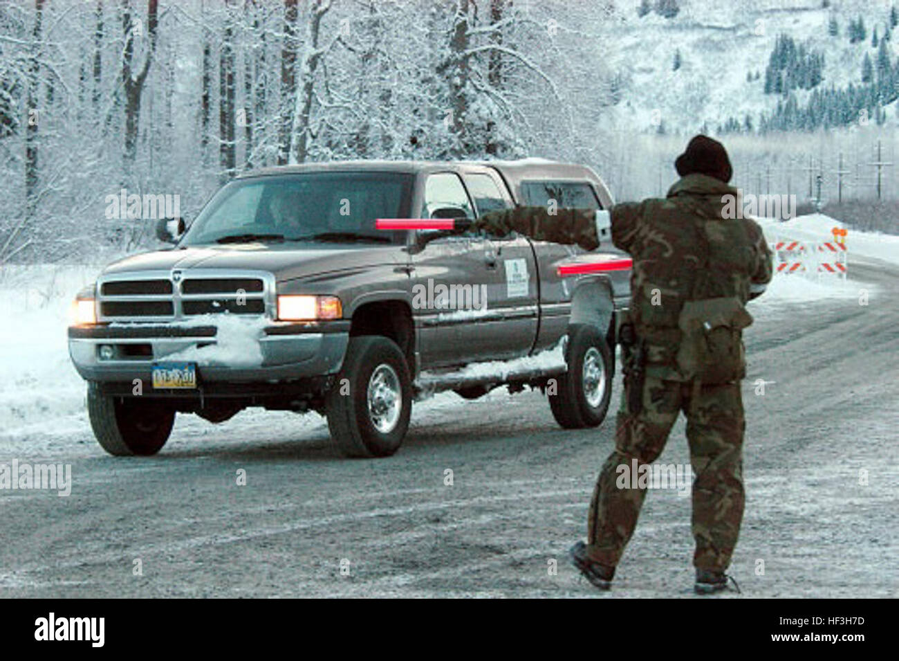 Alaska State Defense Force member directing traffic Stock Photo - Alamy
