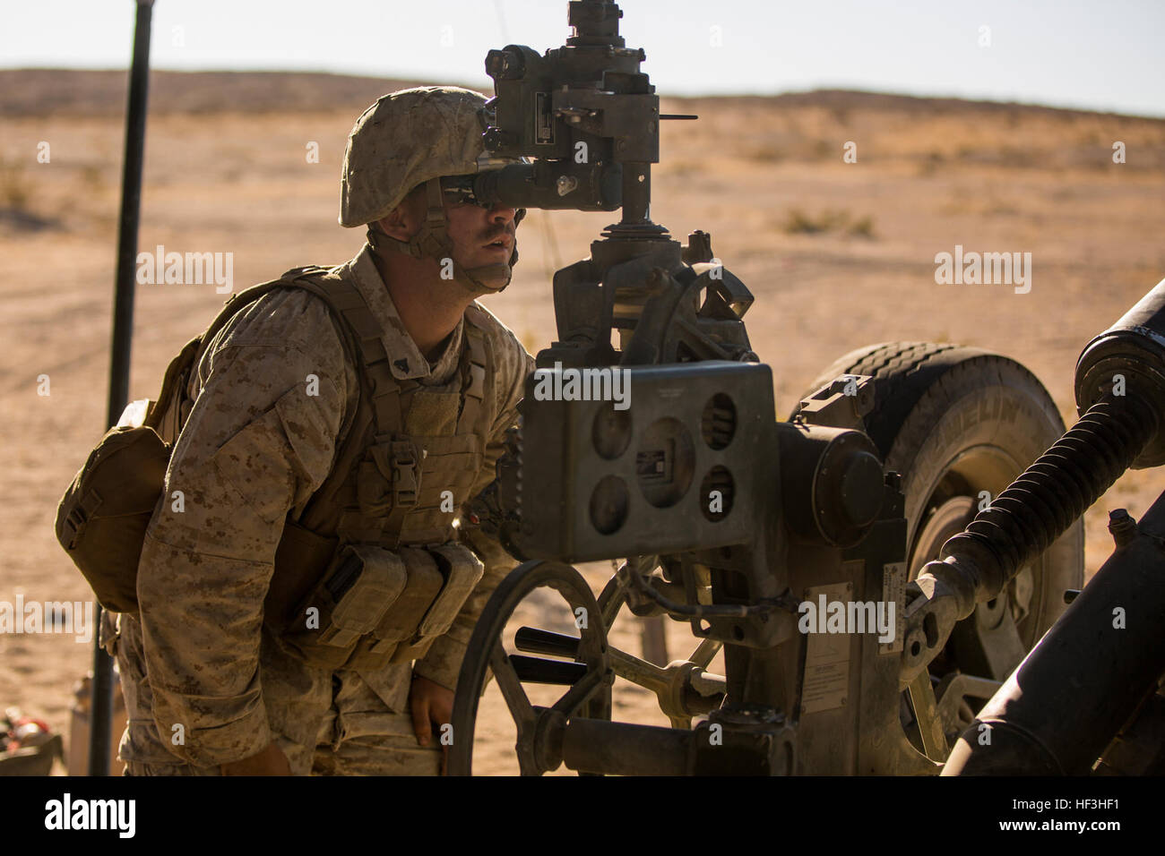 U.S. Marine Corps Cpl. Sean Slaton, assistant gunner with Battery C ...