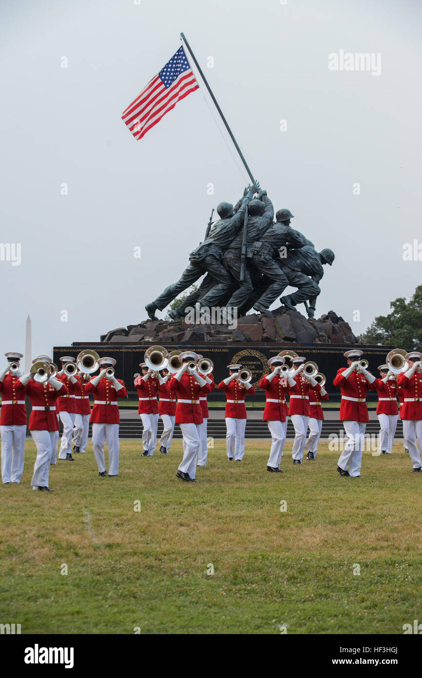 Members of the U.S. Marine Band perform during a sunset parade at the ...