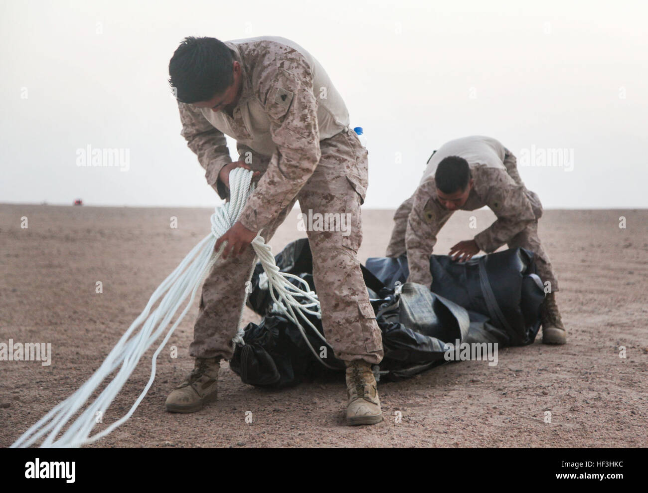 U.S. Marine Corporals Angel Navarrete and Jordan Trujillo, parachute ...
