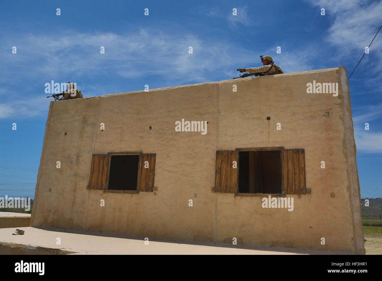 U.S. Marines with 2nd Battalion, 1st Marine Regiment, provide overwatch ...