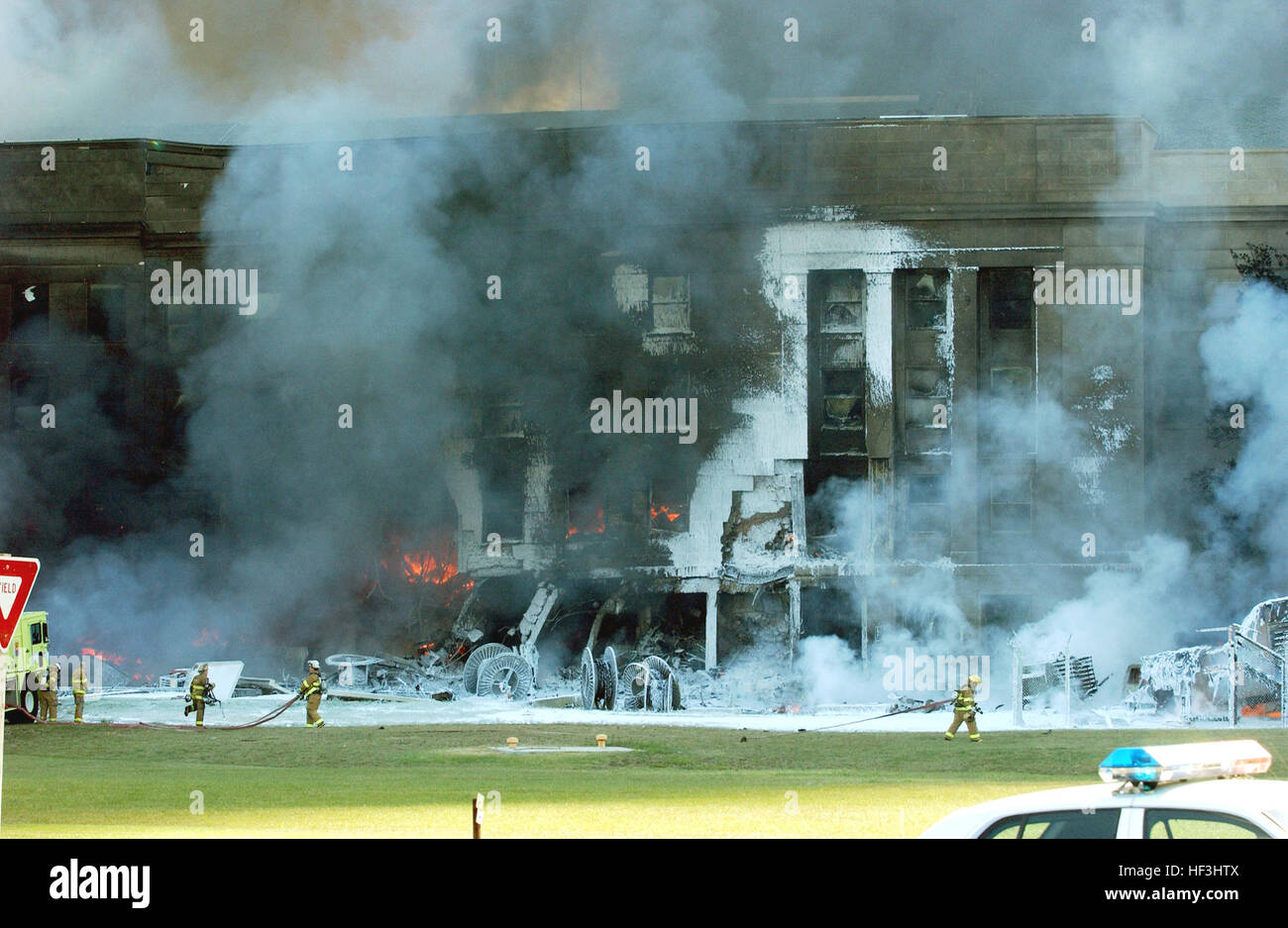 Firefighters respond to a hijacked jetliner crash at the Pentagon on ...